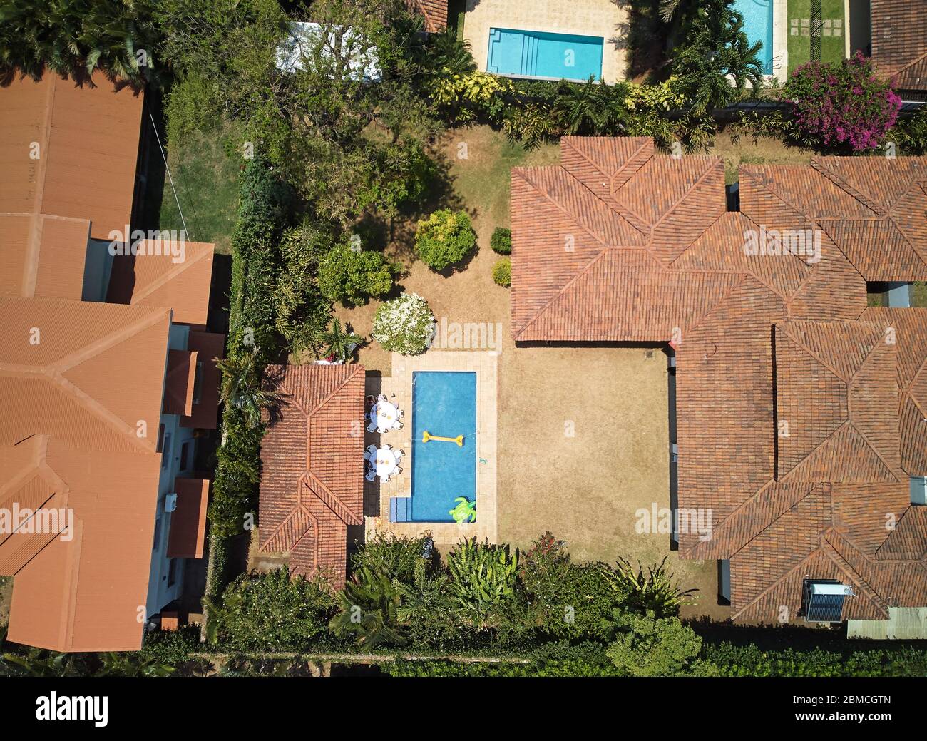 Backyards with swimming pool above top view Stock Photo - Alamy