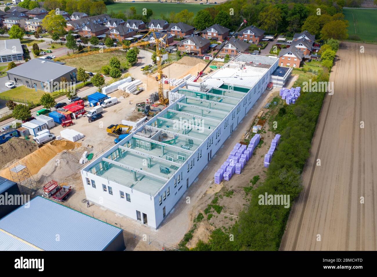 a drone photograph of a large construction site on which a large ...