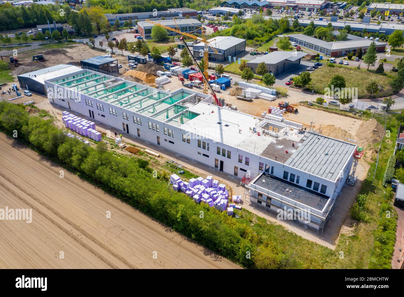 a drone photograph of a large construction site on which a large ...