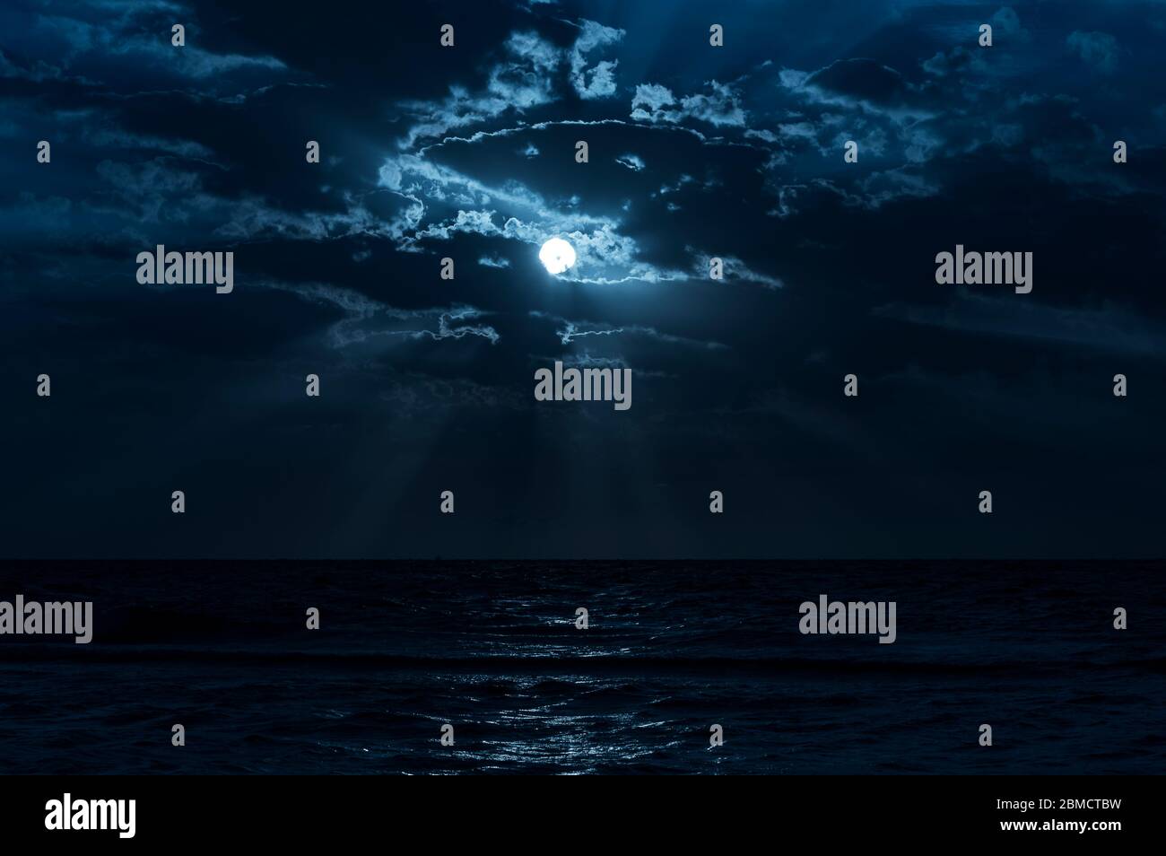 Blue sky with moonlight and reflection of light Stock Photo - Alamy