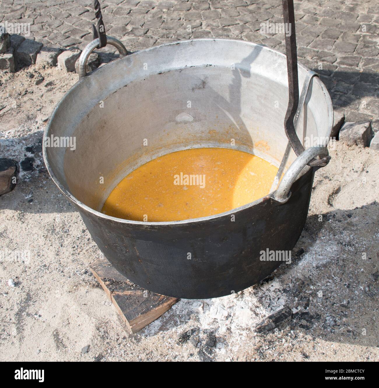 Traditional pot over fire and steam coming from it, authentic medieval ...