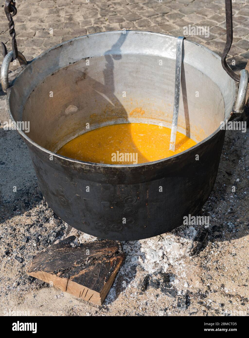Traditional pot over fire and steam coming from it, authentic medieval ...