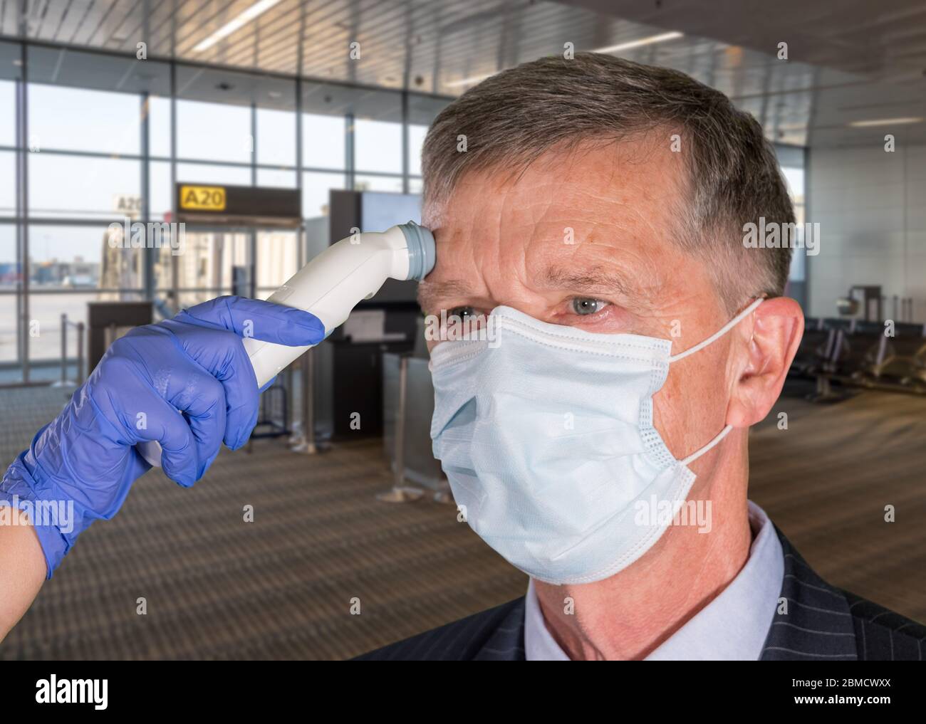 Mockup of airport terminal with senior adult wearing mask having a ...