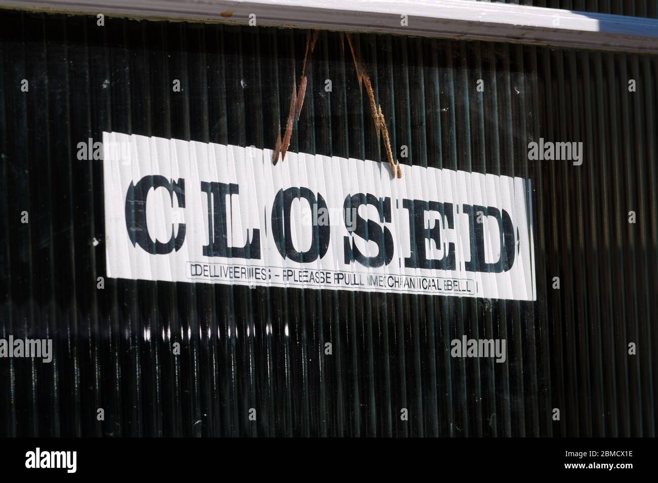 Closed sign hanging on the privacy glass window Stock Photo - Alamy