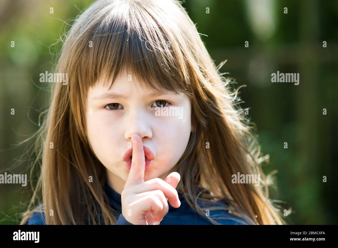 Whisper finger close hi-res stock photography and images - Alamy