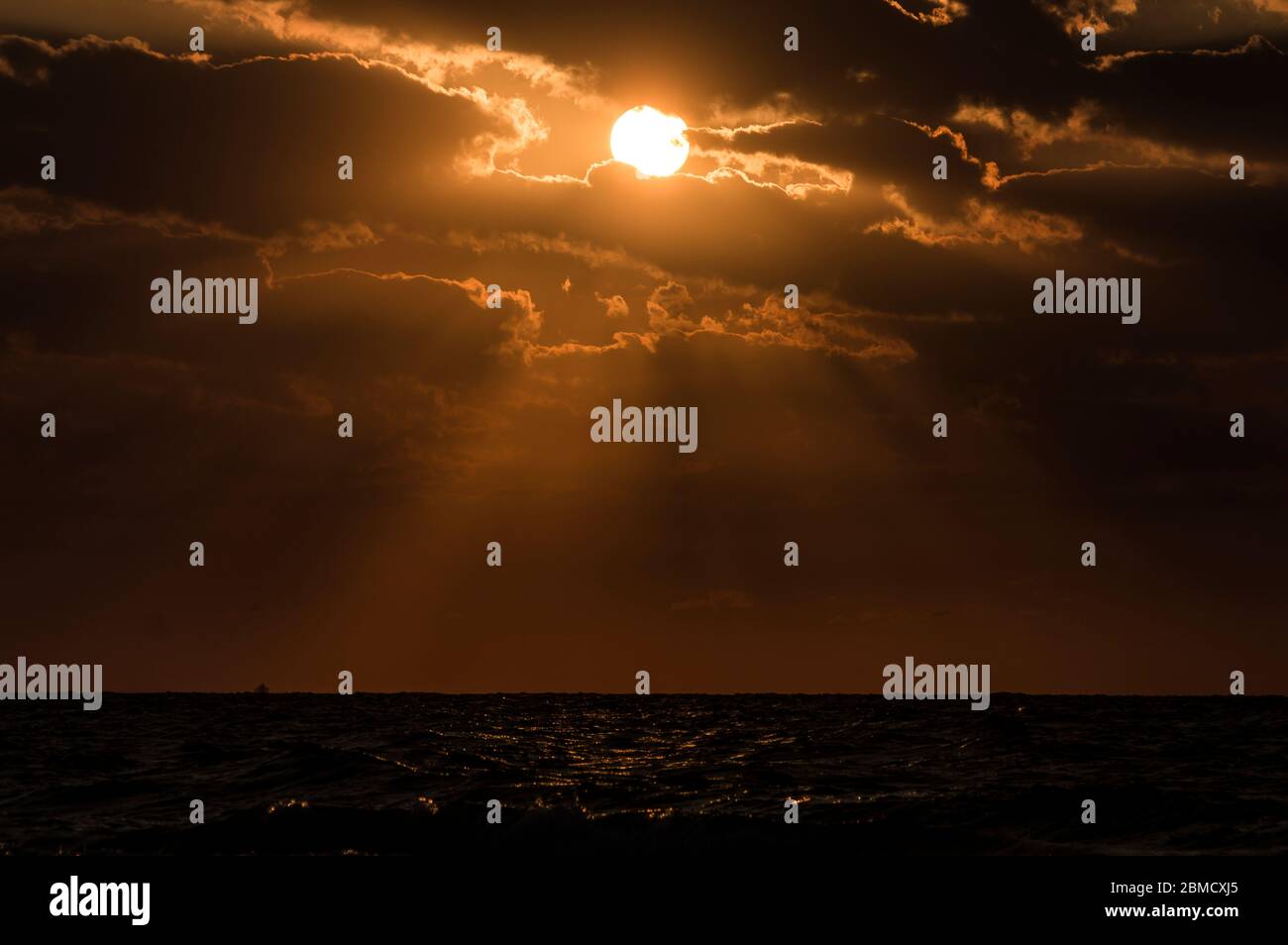 Golden hour of sunset at red sea shore with dramatic sky and the golden ...