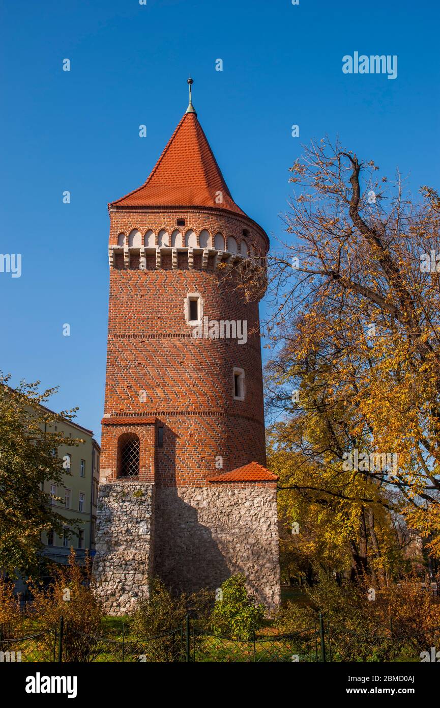 The city wall with towers is surrounding the old town in Krakow, Poland ...