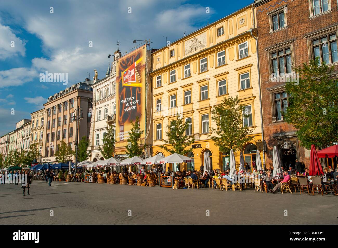People enjoying the sidewalk cafes and restaurants on the market square ...