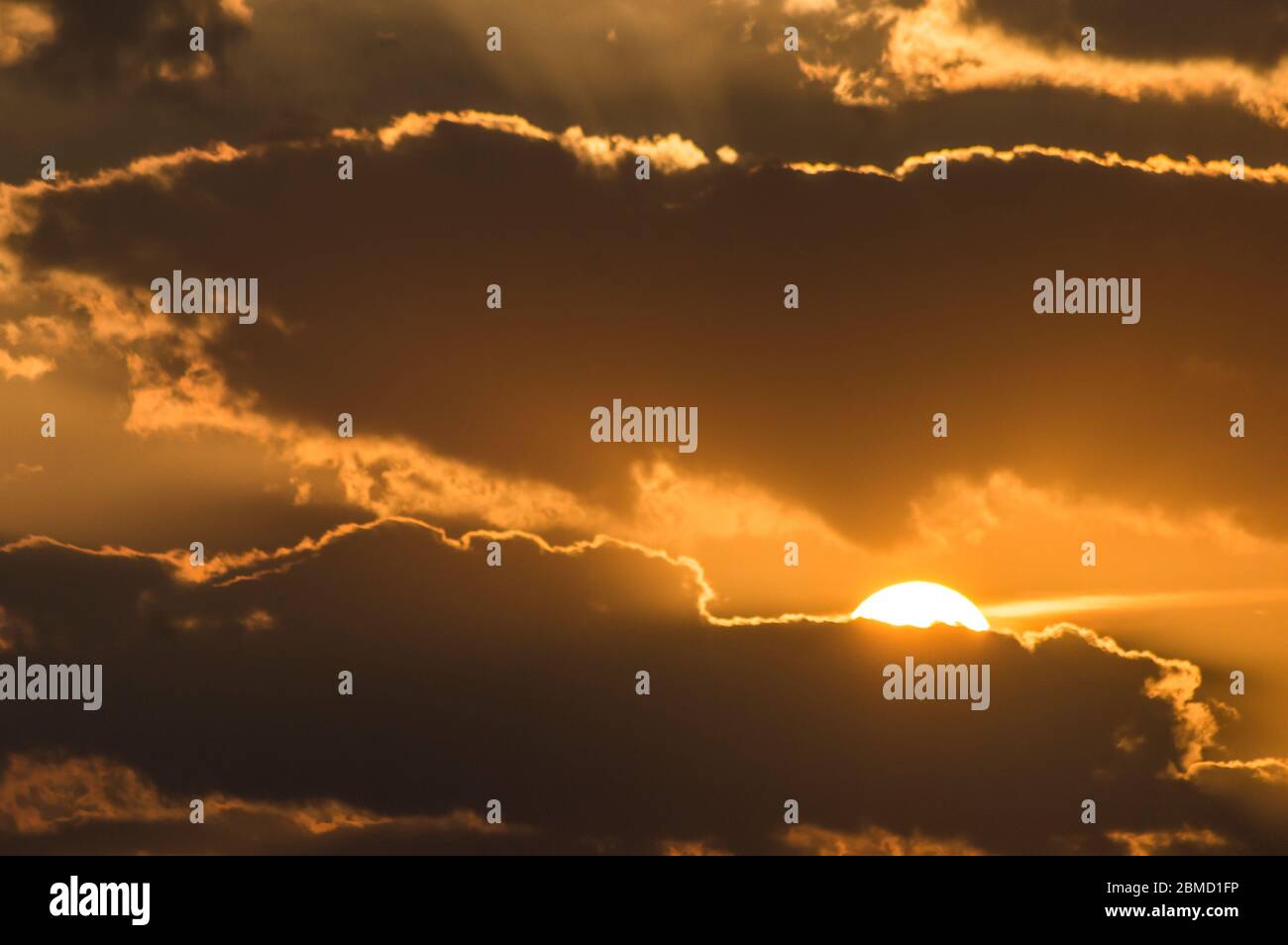 Golden hour of sunset at red sea shore with dramatic sky and the golden ...