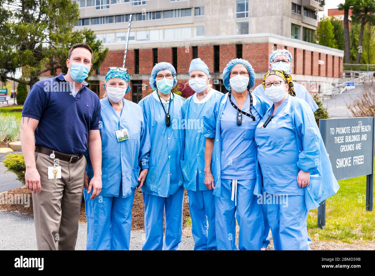 Healthcare workers standing outside of Emerson Hospital after the ...