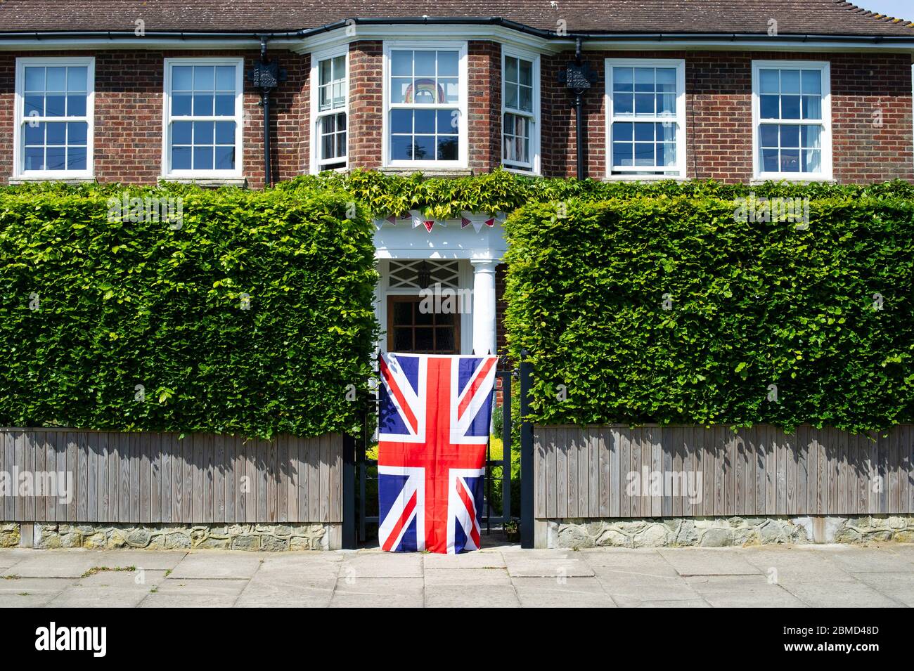 Union Jack flag and bunting on house in estate Stock Photo - Alamy