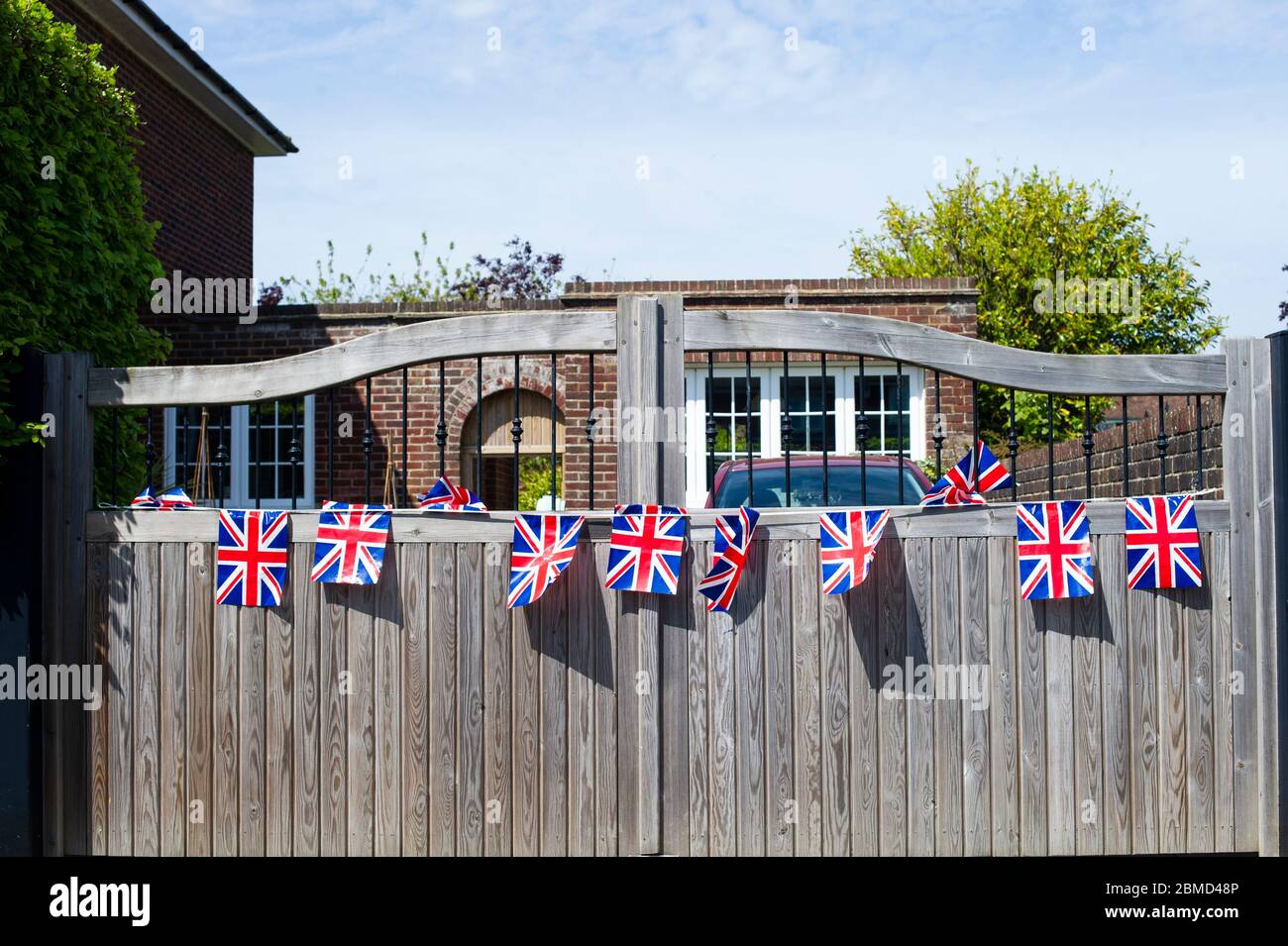 Union Jack flag and bunting on house in estate Stock Photo - Alamy