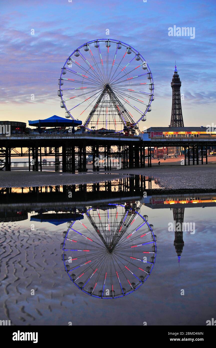 The Ferris wheel on Central Pier in Blackpool shines in red white and ...