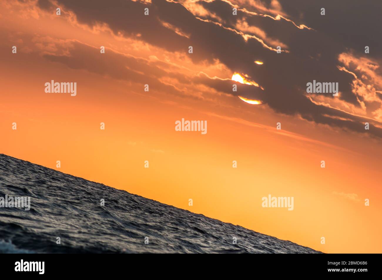 Golden hour of sunset at red sea shore with dramatic sky and the golden ...
