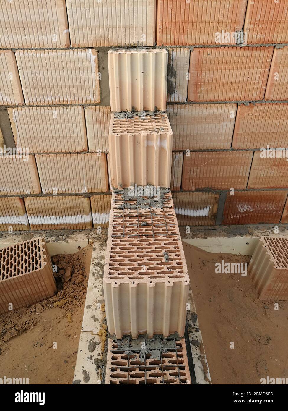 Unfinished construction wall build from ceramic blocks in construction ...