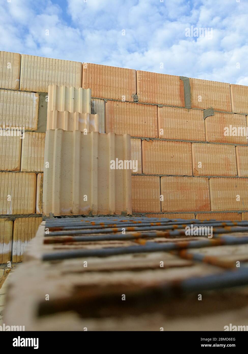 Unfinished construction wall build from ceramic blocks in construction ...