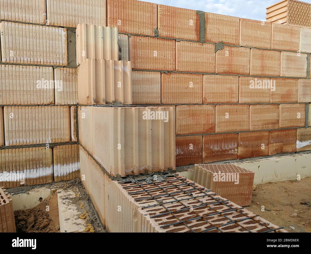 Unfinished construction wall build from ceramic blocks in construction ...
