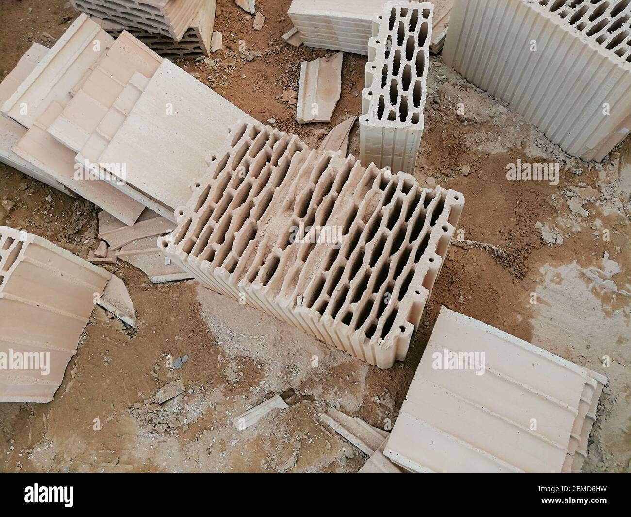 Damaged ceramic construction block in the construction site. Wastage ...