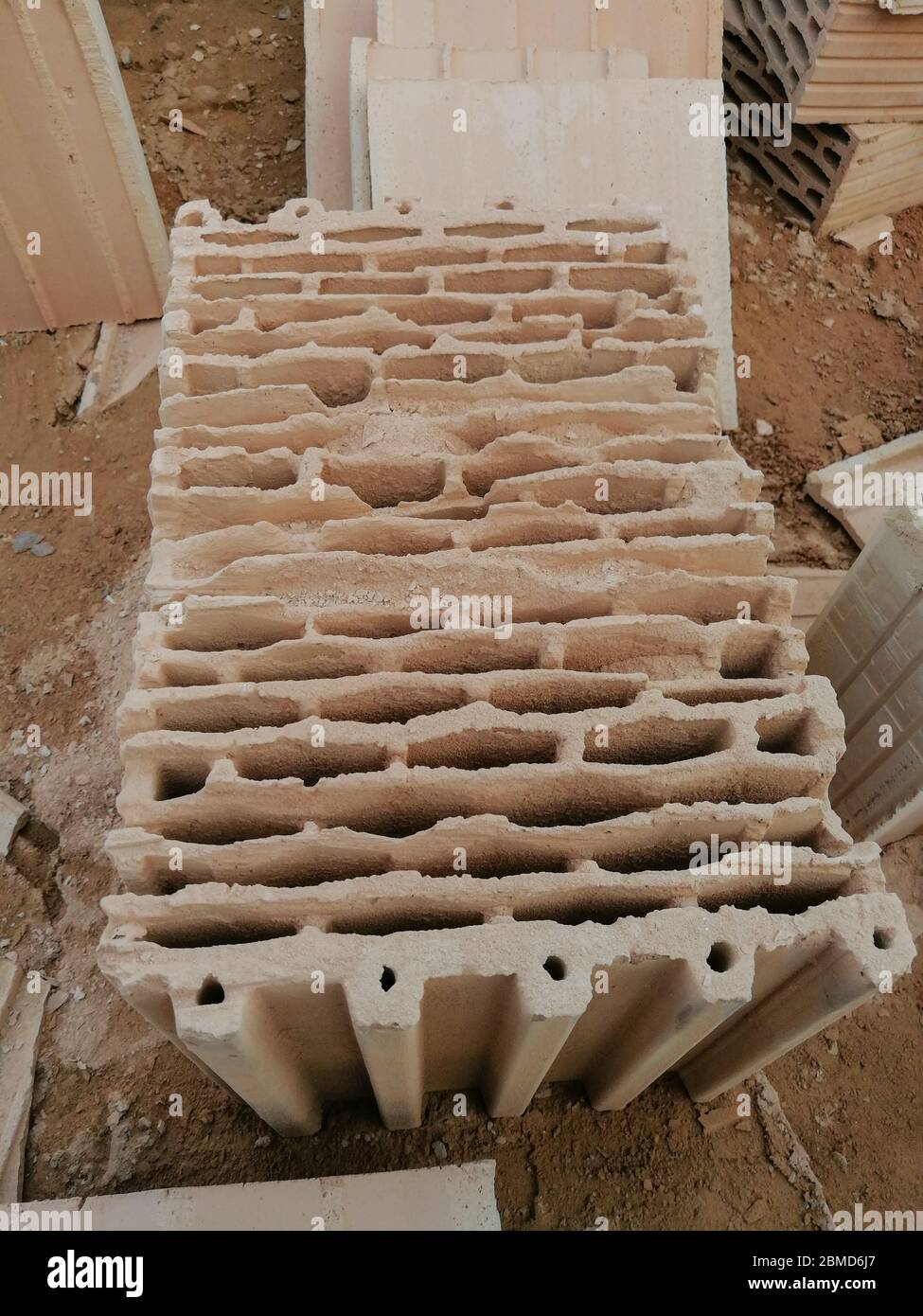 Damaged ceramic construction block in the construction site. Wastage ...