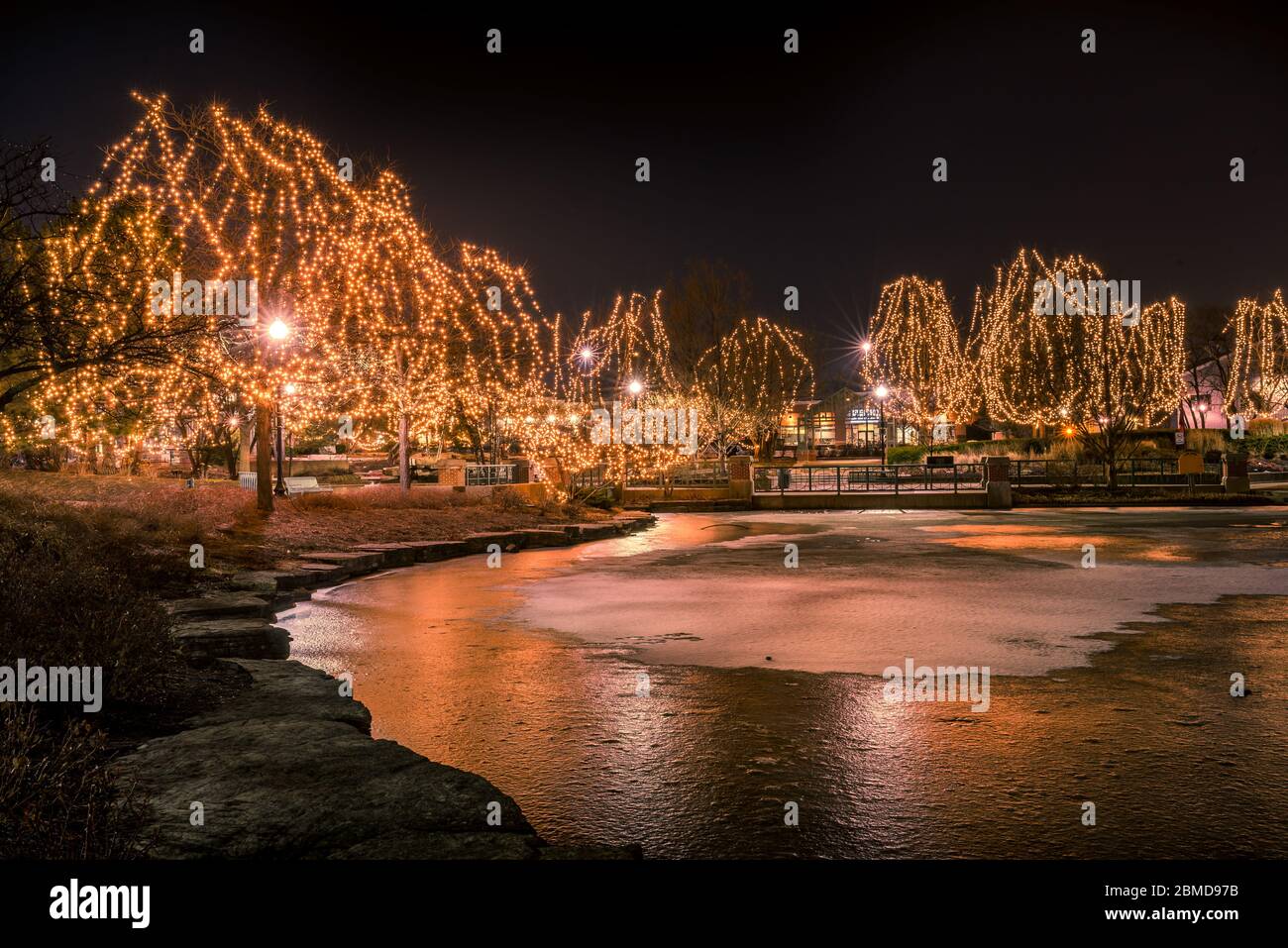 Winter Night Landscape. Frozen Lake and Christmas lights Stock Photo ...