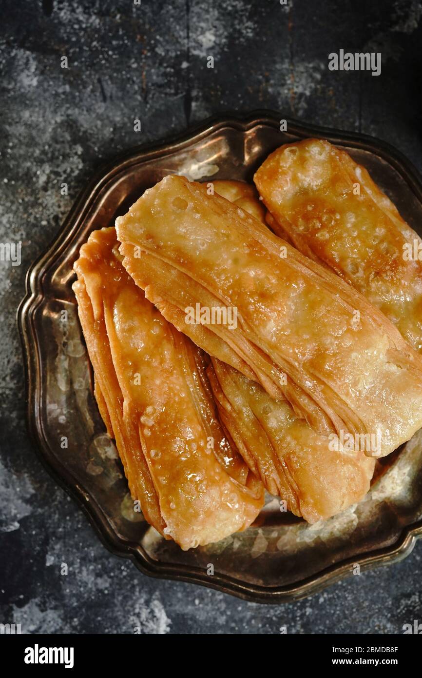 Homemade Indian sweet khaja /chirote or Madakku san, selective focus ...
