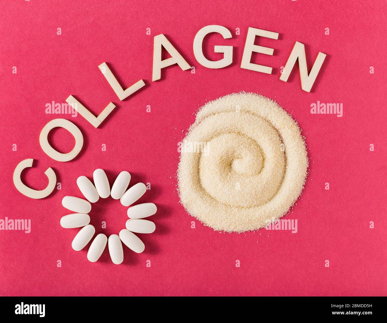 Hydrolyzed and co-compressed collagen, on pink background, top view ...