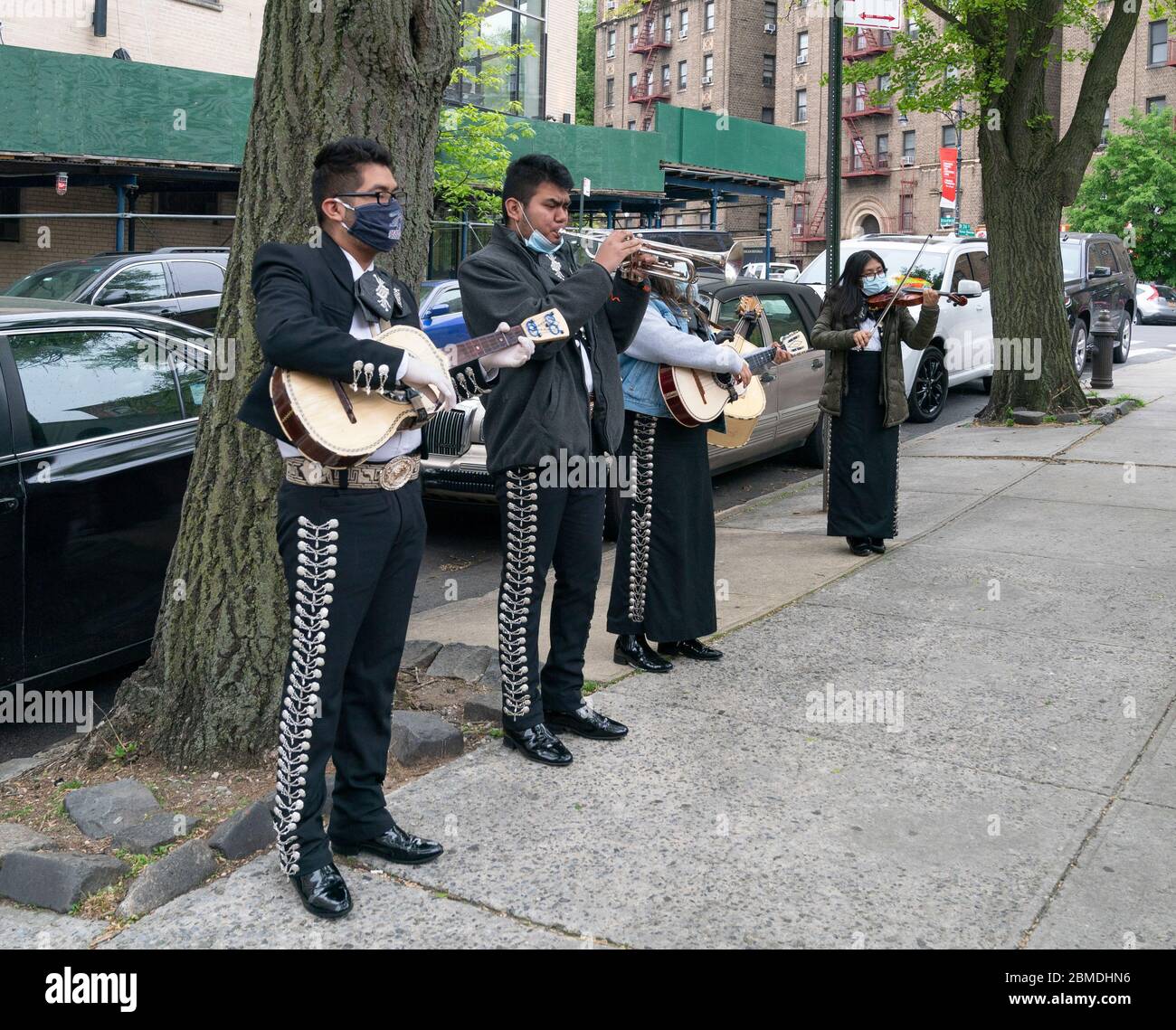 New York, NY - May 8, 2020: Mexican band AMNA plays while amily members ...