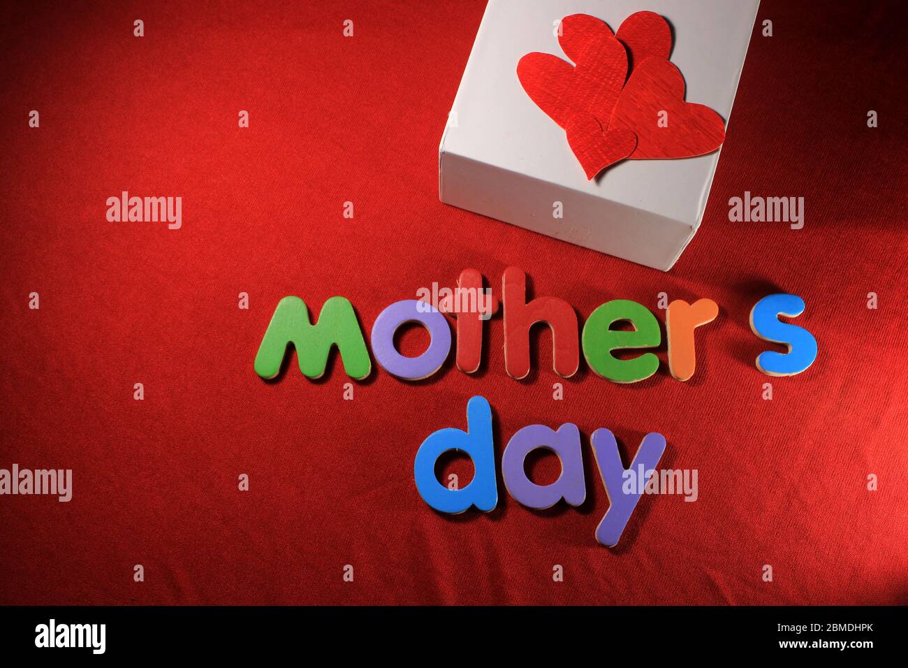 Mother's Day written by colorful alphabet blocks arranged on red ...