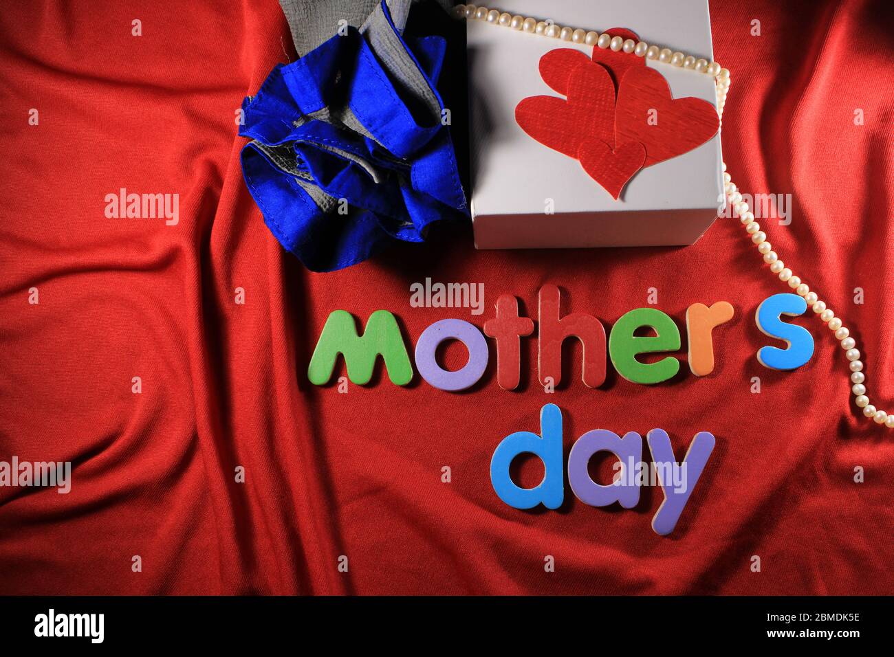 Mother's Day written by colorful alphabet blocks arranged on red ...