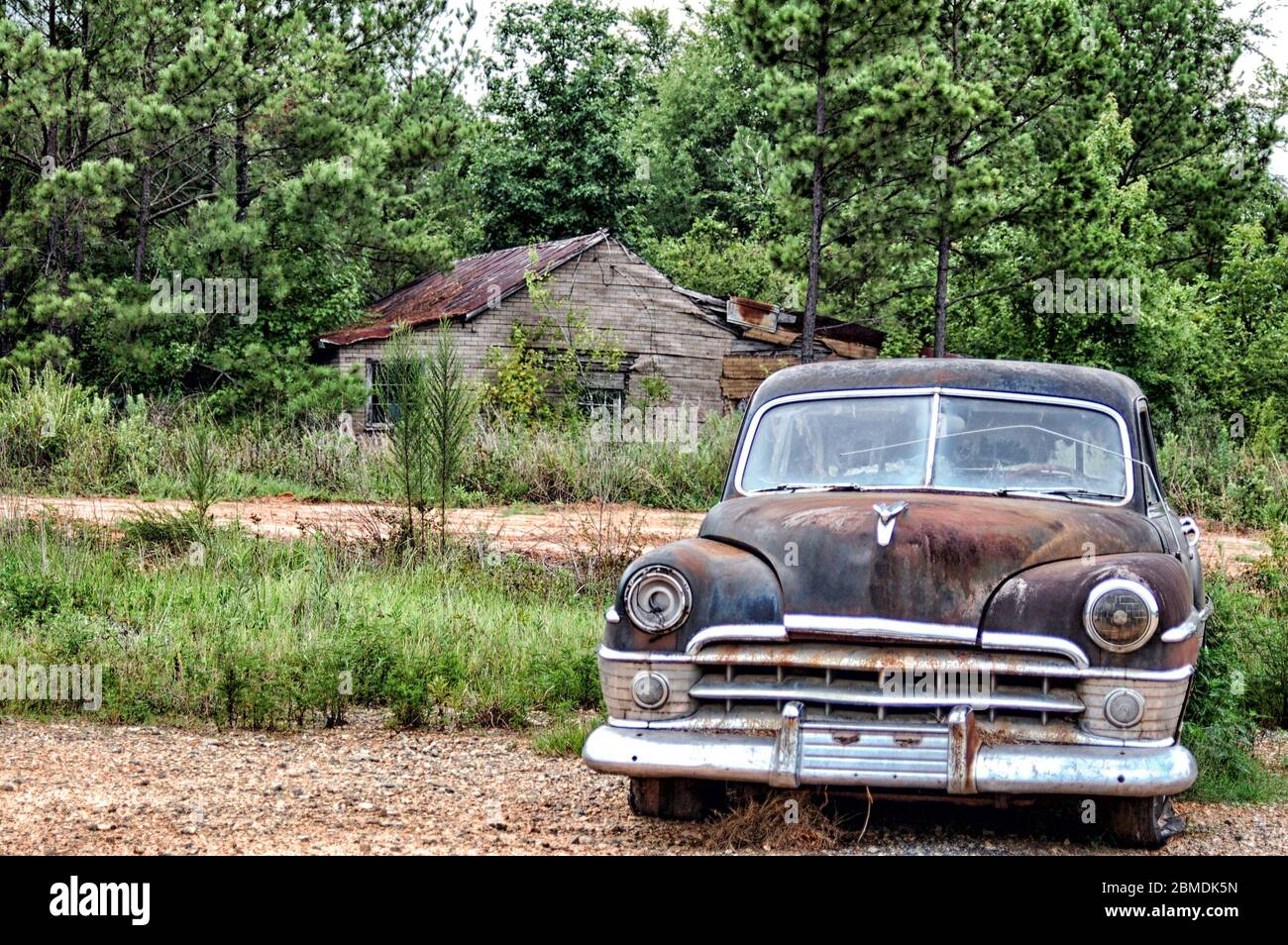 Rusty Vintage Car in front of Shack Stock Photo - Alamy