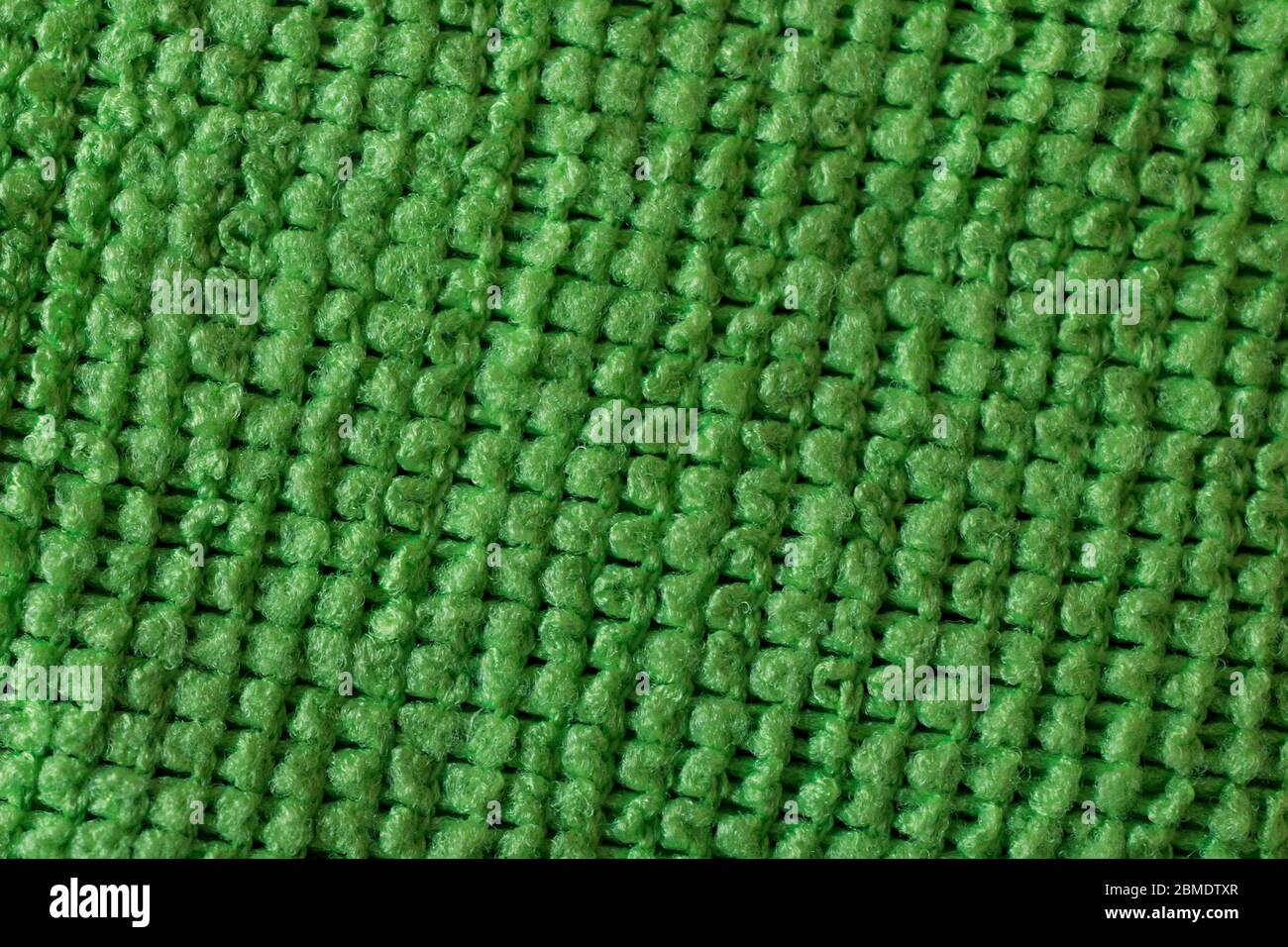 Green texture of a textile fiber cloth. Empty background of green color ...