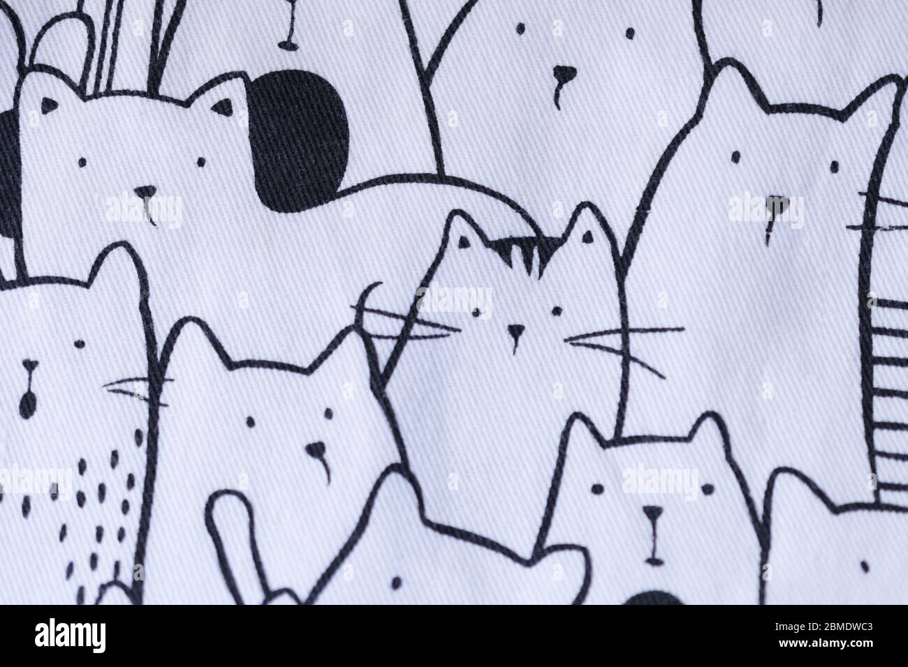 Texture of a white fabric with drawings of cats. Background of cute ...