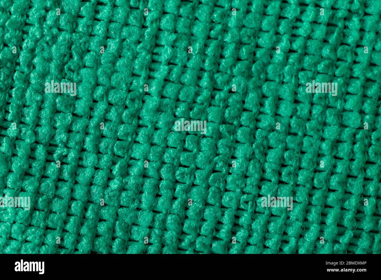 Green texture of a textile fiber cloth. Empty background of mint green ...