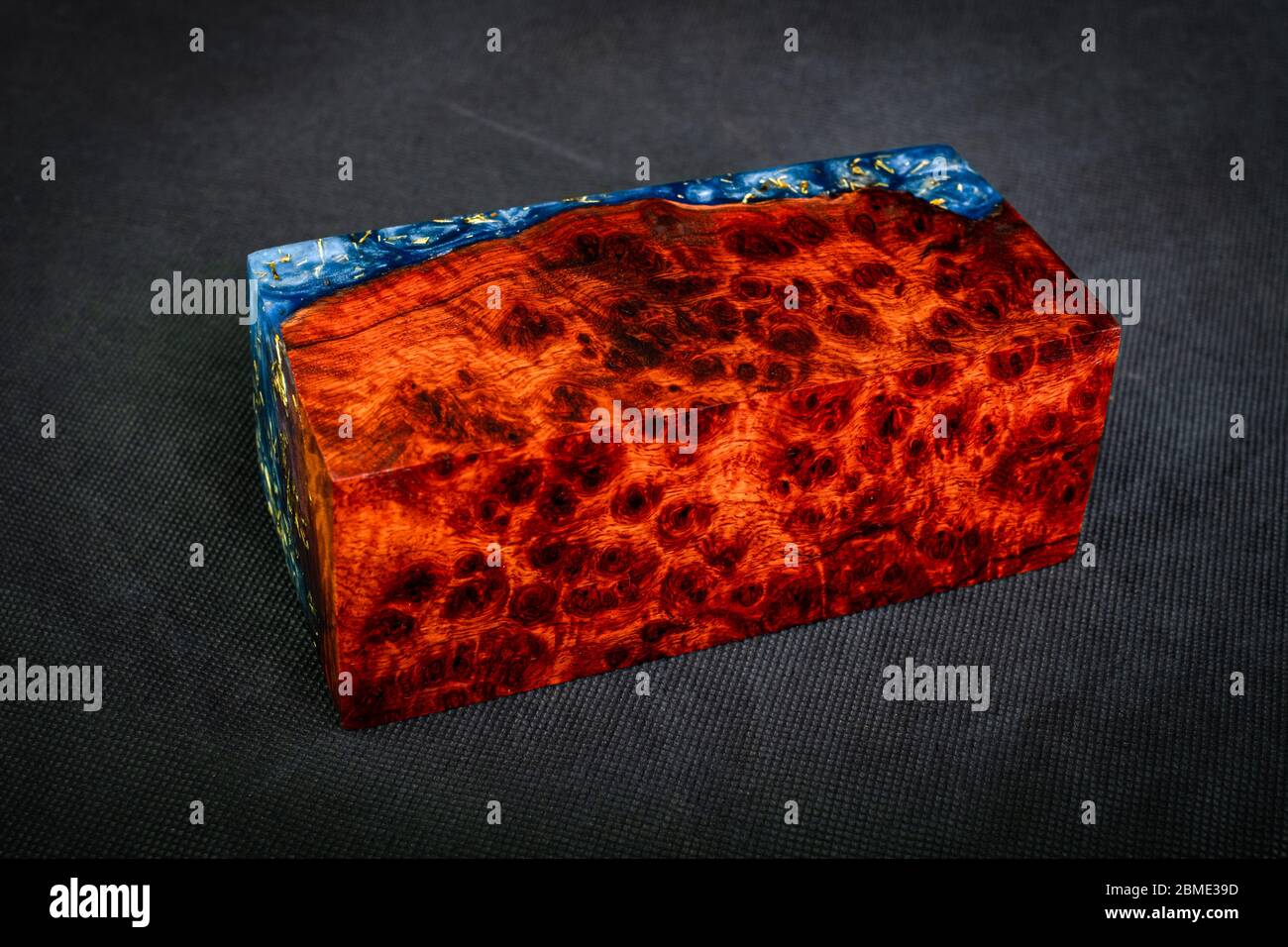 Casting epoxy resin with nature burl BURMA PADAUK wood cube on black ...