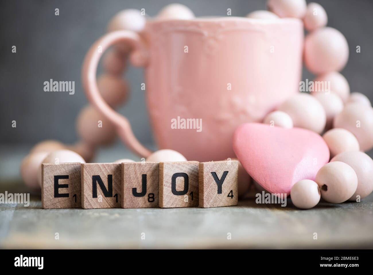 Enjoy in block letters Stock Photo - Alamy
