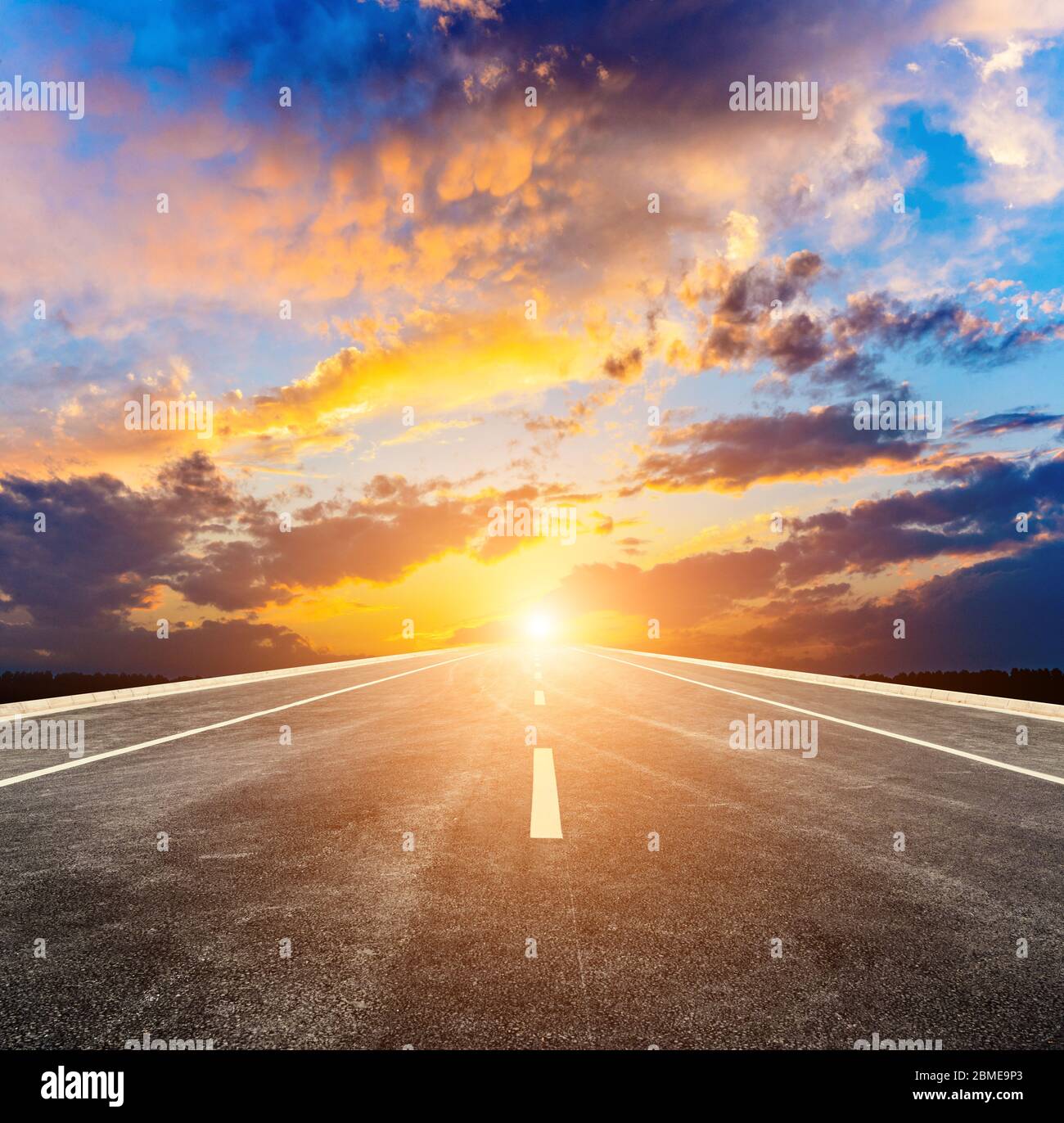 Empty, empty, straight-forward highway in the sunset Stock Photo - Alamy