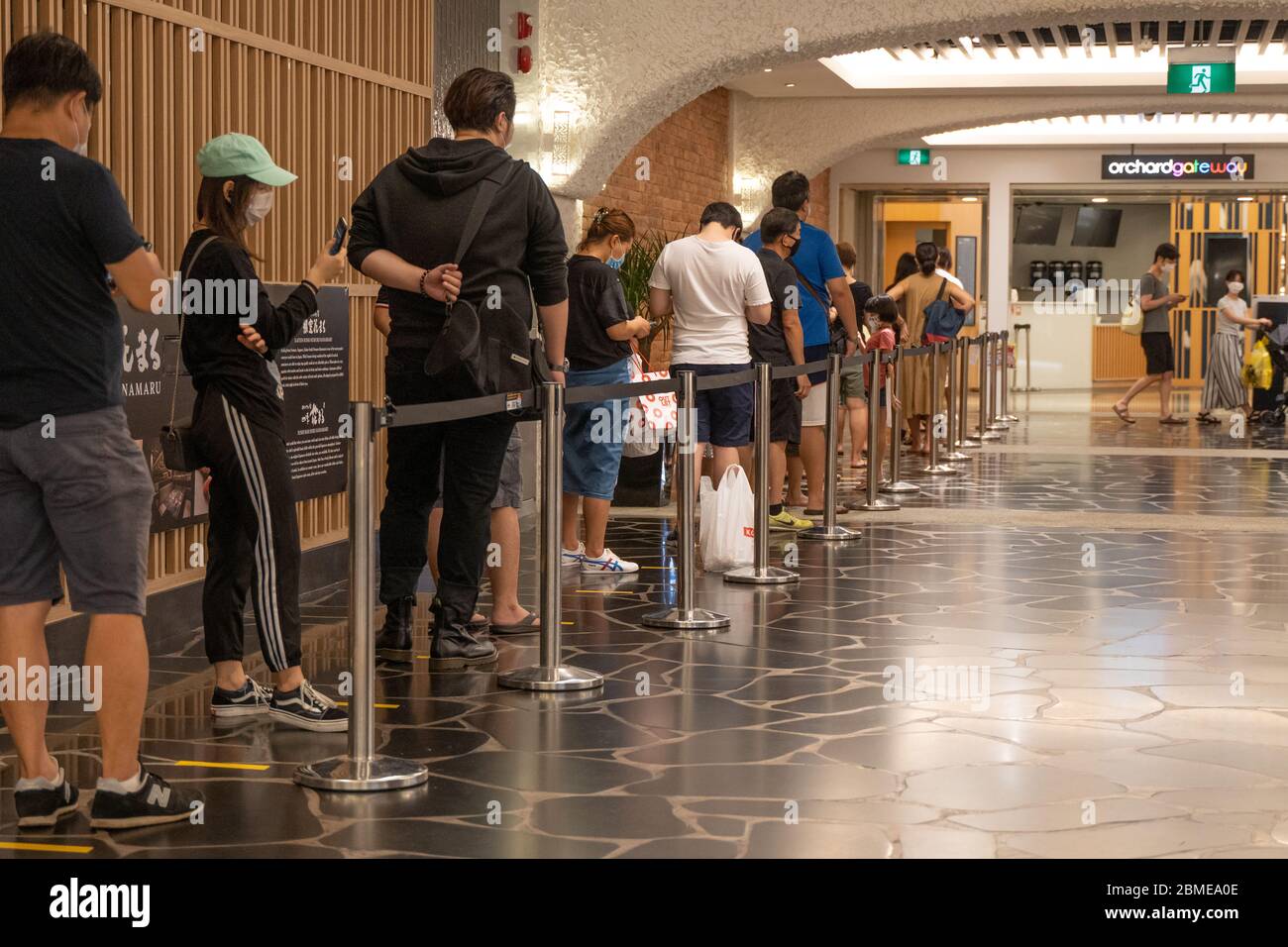 Long queues outside singapore supermarket during Covid 19 Stock Photo ...