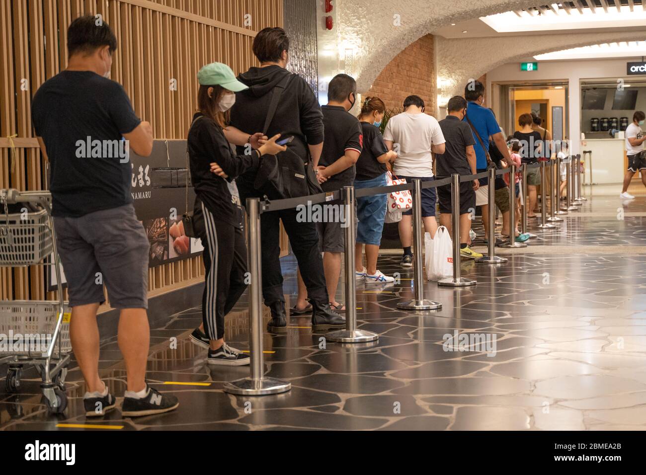 Long queues outside singapore supermarket during Covid 19 Stock Photo ...