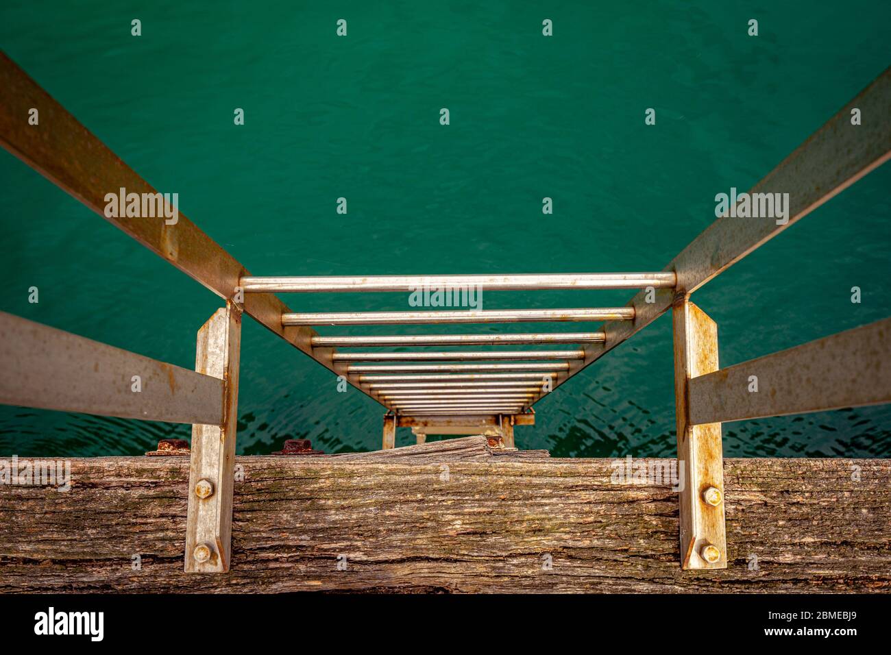 Top down view at the pier side ladder leading down to the water Stock ...
