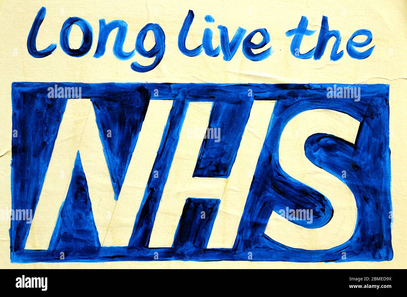A hand made 'Long Live the NHS' poster flyposted on a street in ...