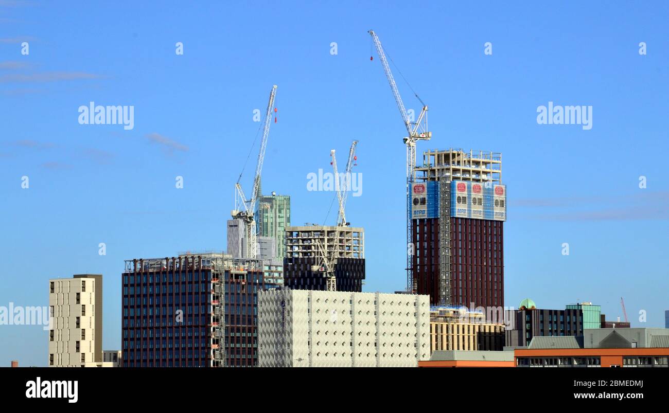 Construction of high rise buildings with tower cranes in central ...