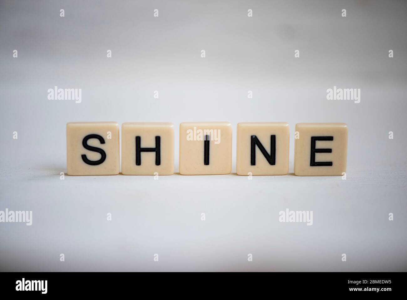 Shine in block letters Stock Photo - Alamy