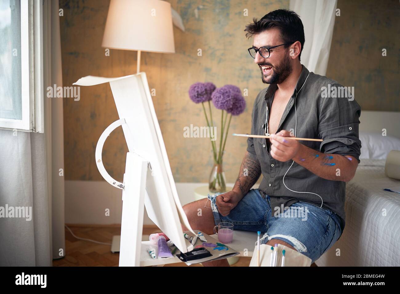 Smiling young painter hi-res stock photography and images - Alamy