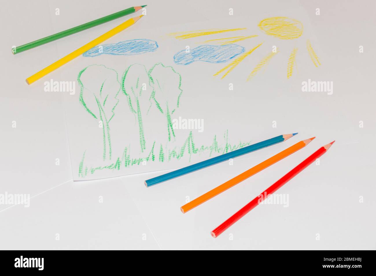 Child's color drawing on a white paper with color pencils Stock Photo ...