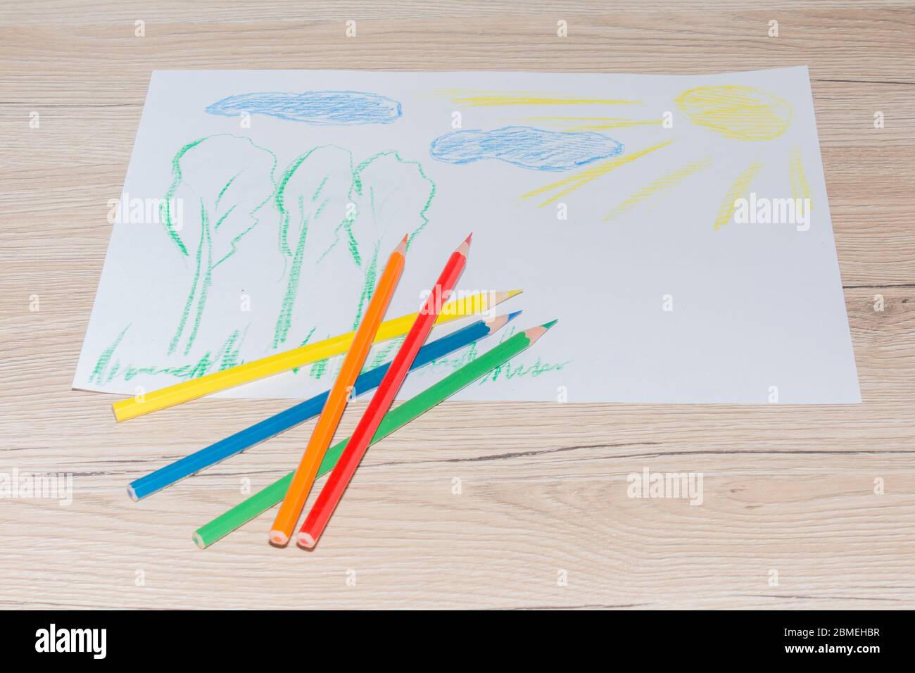 Child's color drawing on a white paper with color pencils Stock Photo ...