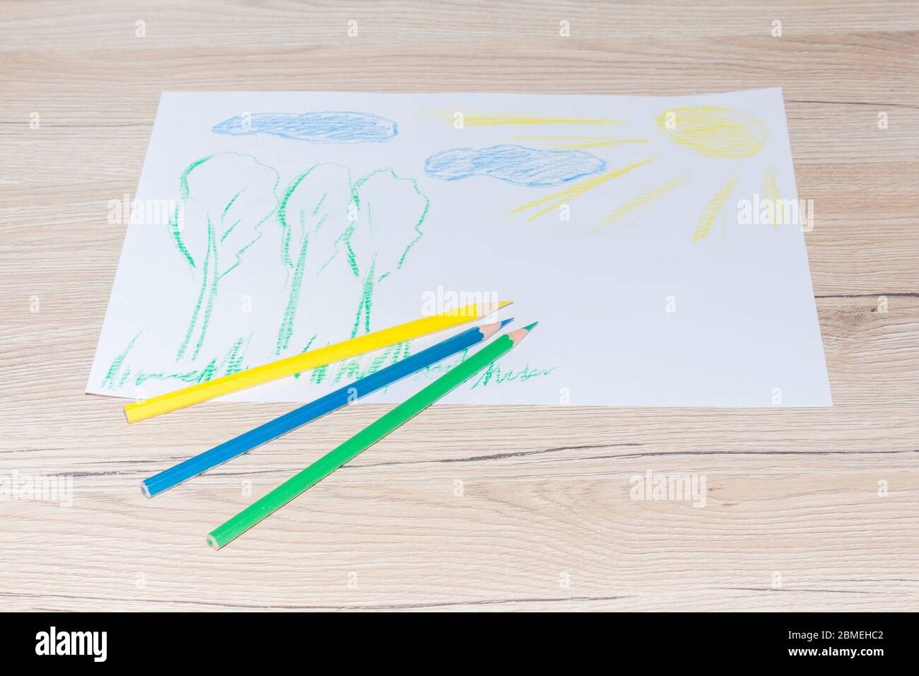 Child's color drawing on a white paper with color pencils Stock Photo ...