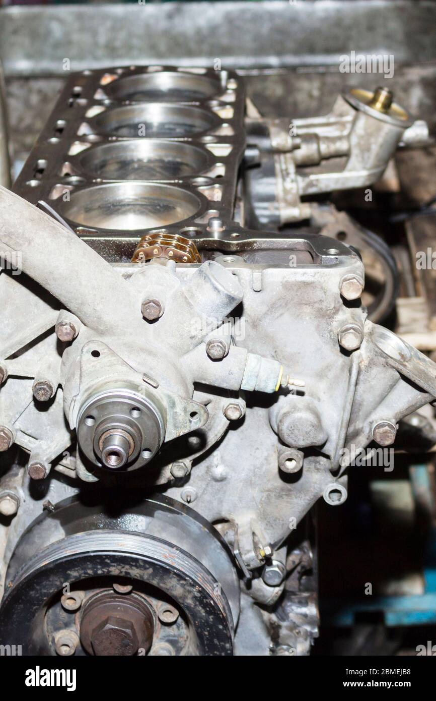 Disassembled car dirty engine close-up to engine parts at car garage ...