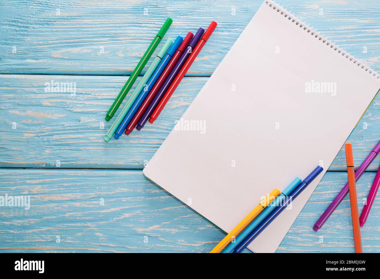 Colored felt pens and sheet of white paper Stock Photo - Alamy