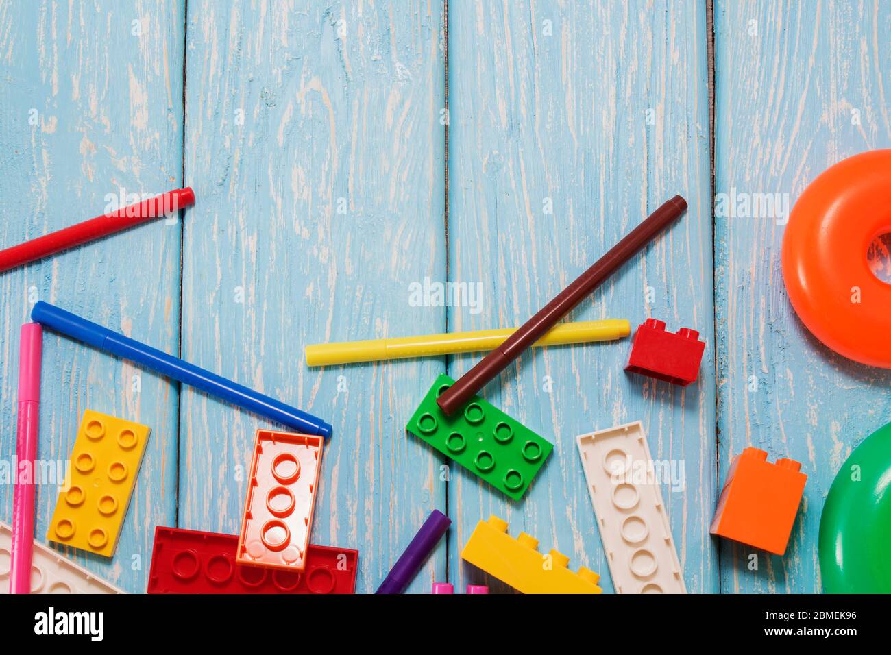Multicolored plastic building blocks of the designer. Background of ...