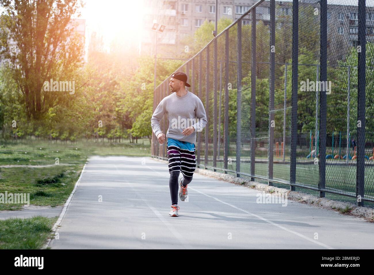 Young man running outdoor hi-res stock photography and images - Alamy